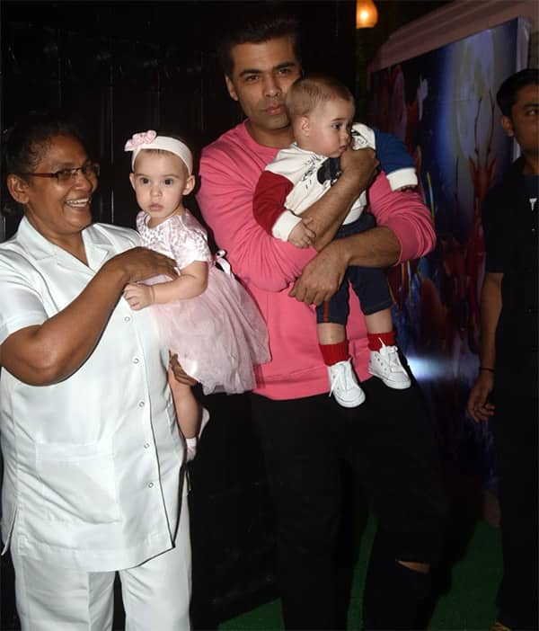 Karan Johar is all smiles as he steps out with his kids, Yash and Roohi ...
