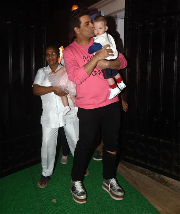 Karan Johar is all smiles as he steps out with his kids, Yash and Roohi ...