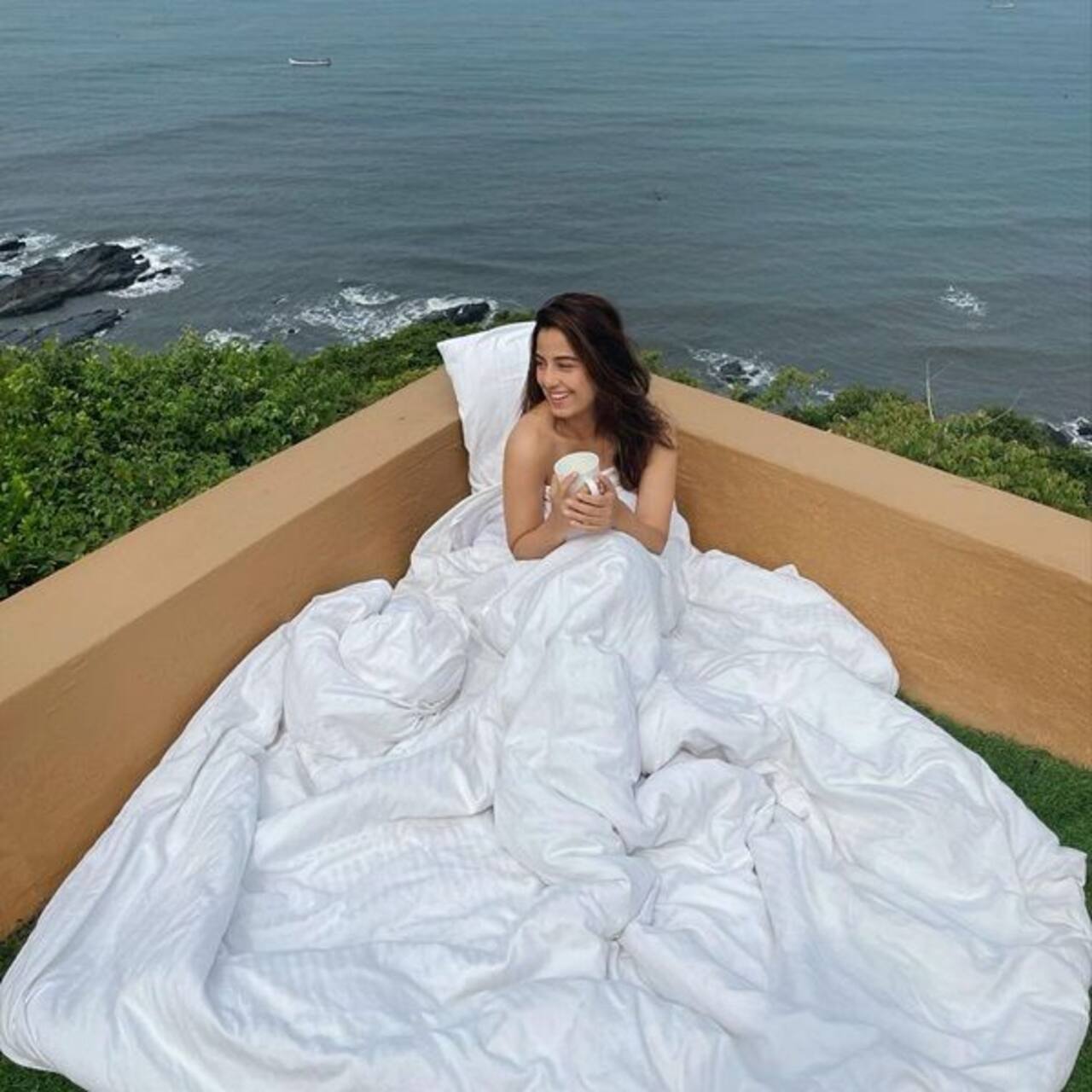 Srishty Rode turns up the heat as she wakes up topless while sipping a ...