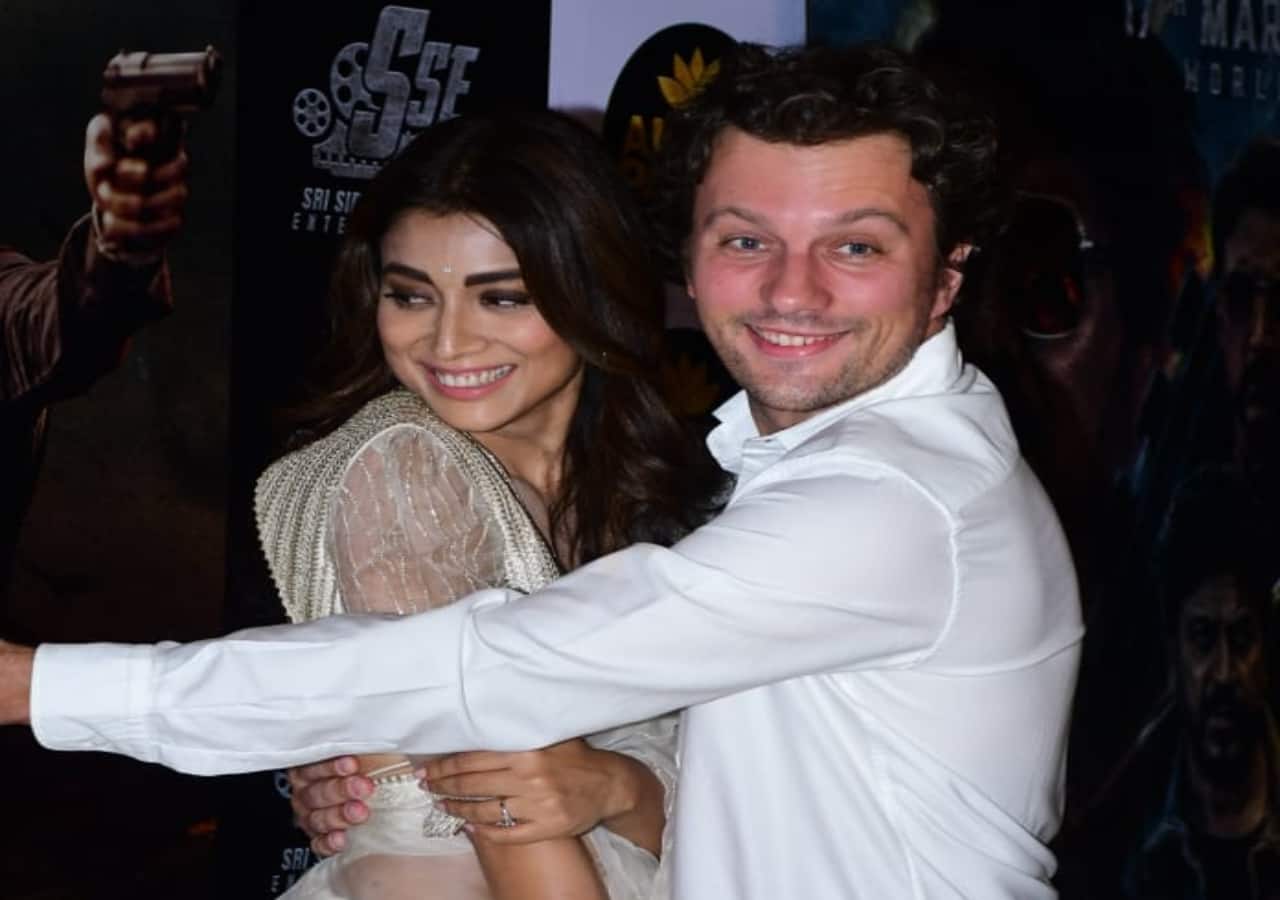 Shriya Saran's husband Andrei Koscheev kisses her at Kabzaa screening ...