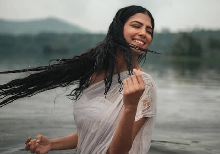 South Indian actress Malavika Mohanan takes a dip in the lake in a white saree, oozes oomph