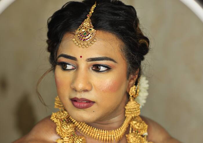 beauty with muscle: bodybuilder chitra purushottam bride look in gold ...
