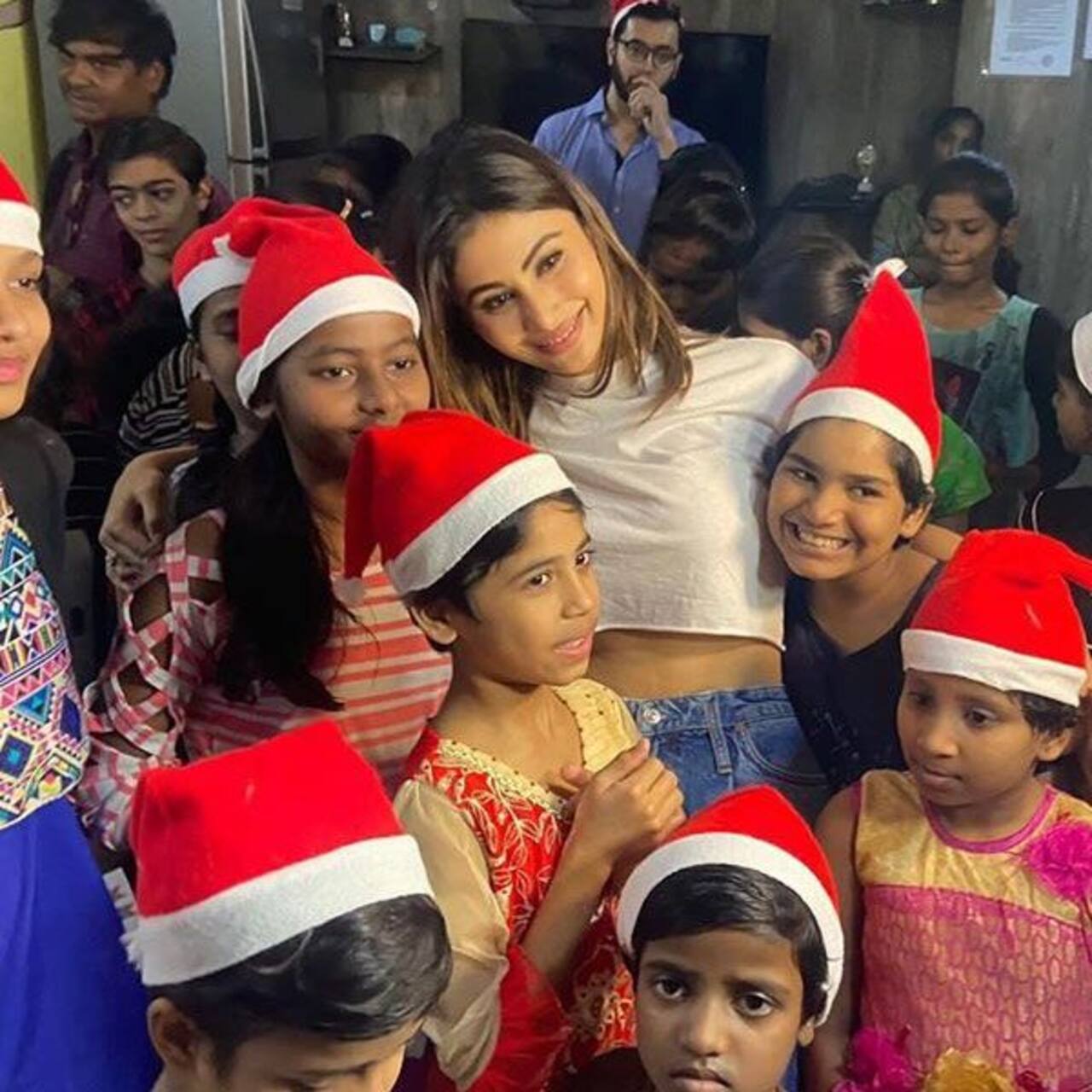 Mouni Roy soaks in the X'Mas spirit as she enjoys a party with children ...